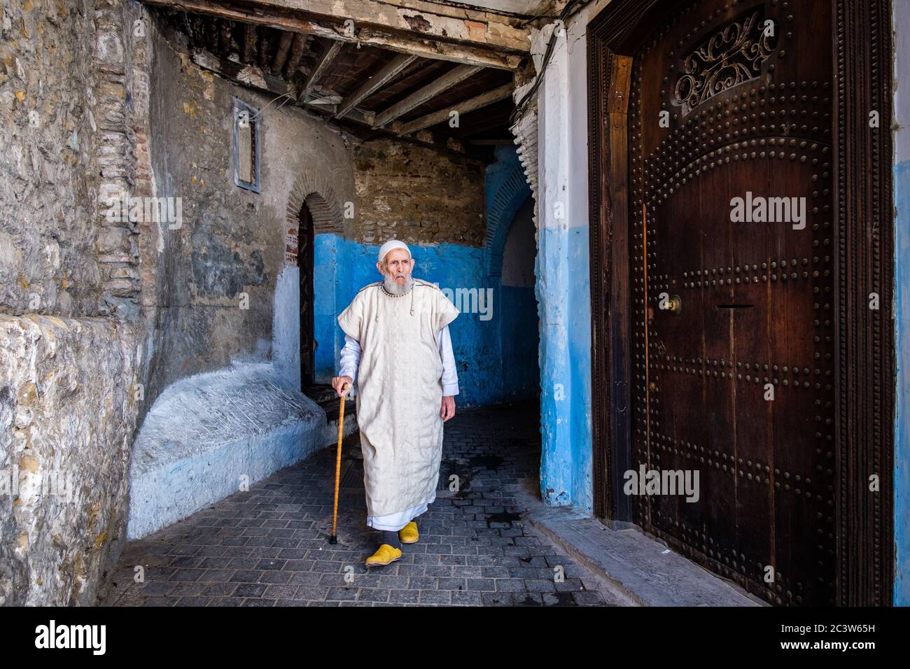Morocco, Tangier: atmosphere in a street of the Old Town. Old man ...
