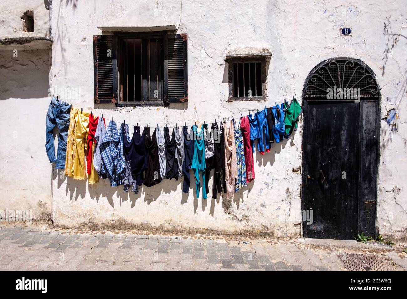Morocco, Tangier: laundry drying on the facade of a house in the medina ...