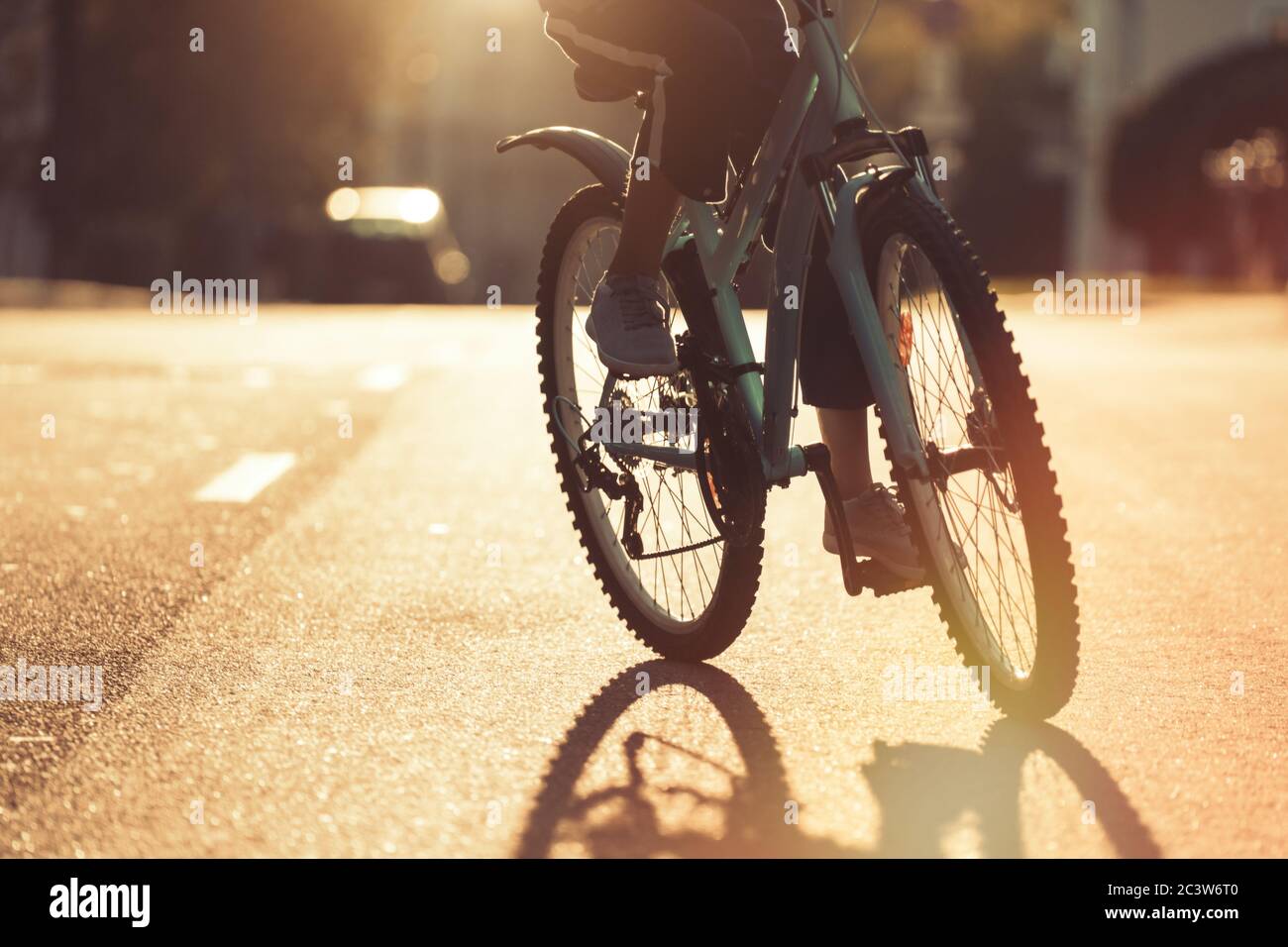 Girl Kid Riding Bike in Summer in City at Beautiful Sunset Stock Photo ...
