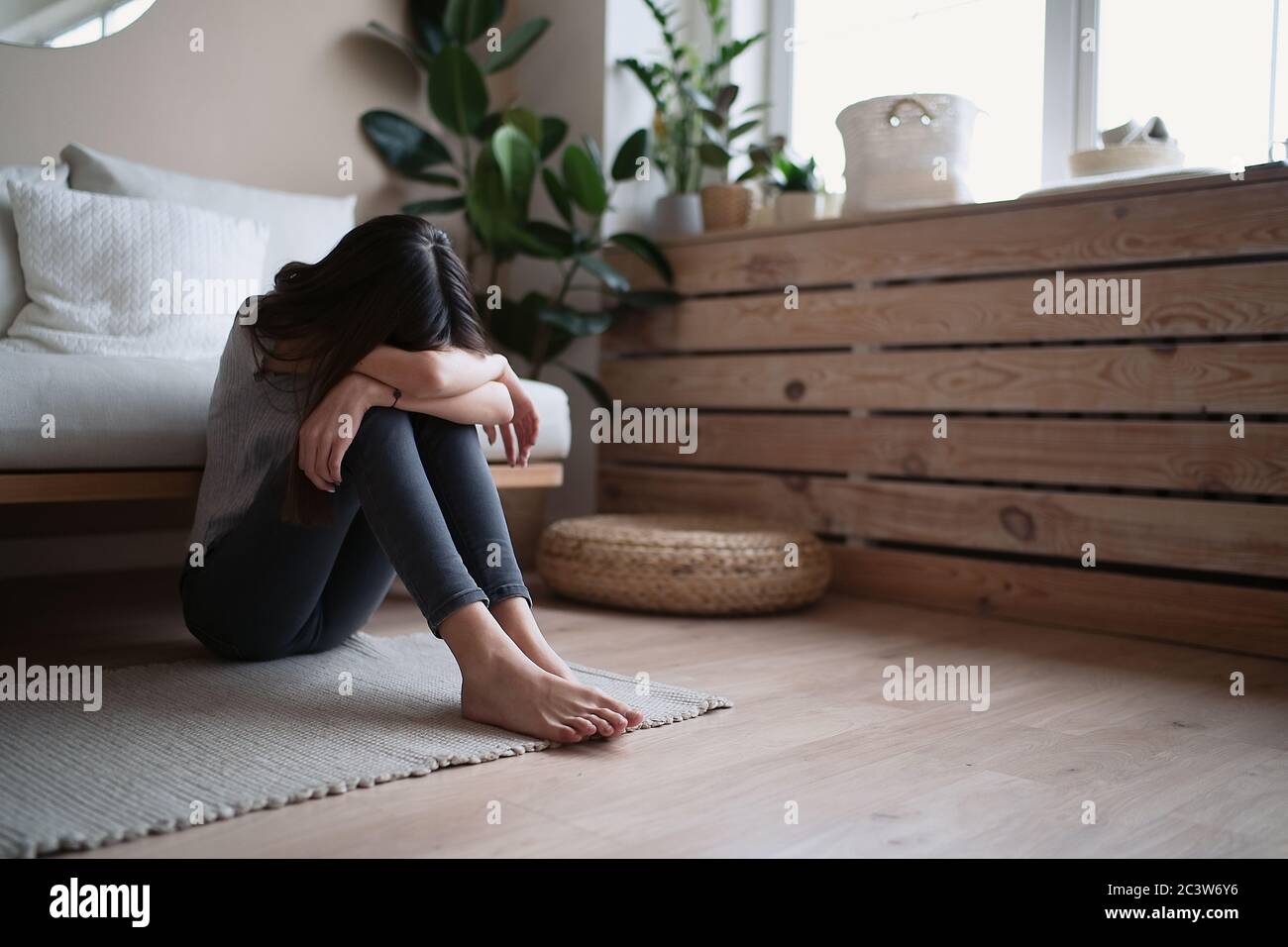 Sad teenager feeling bad alone holding head in hands, feeling depressed ...
