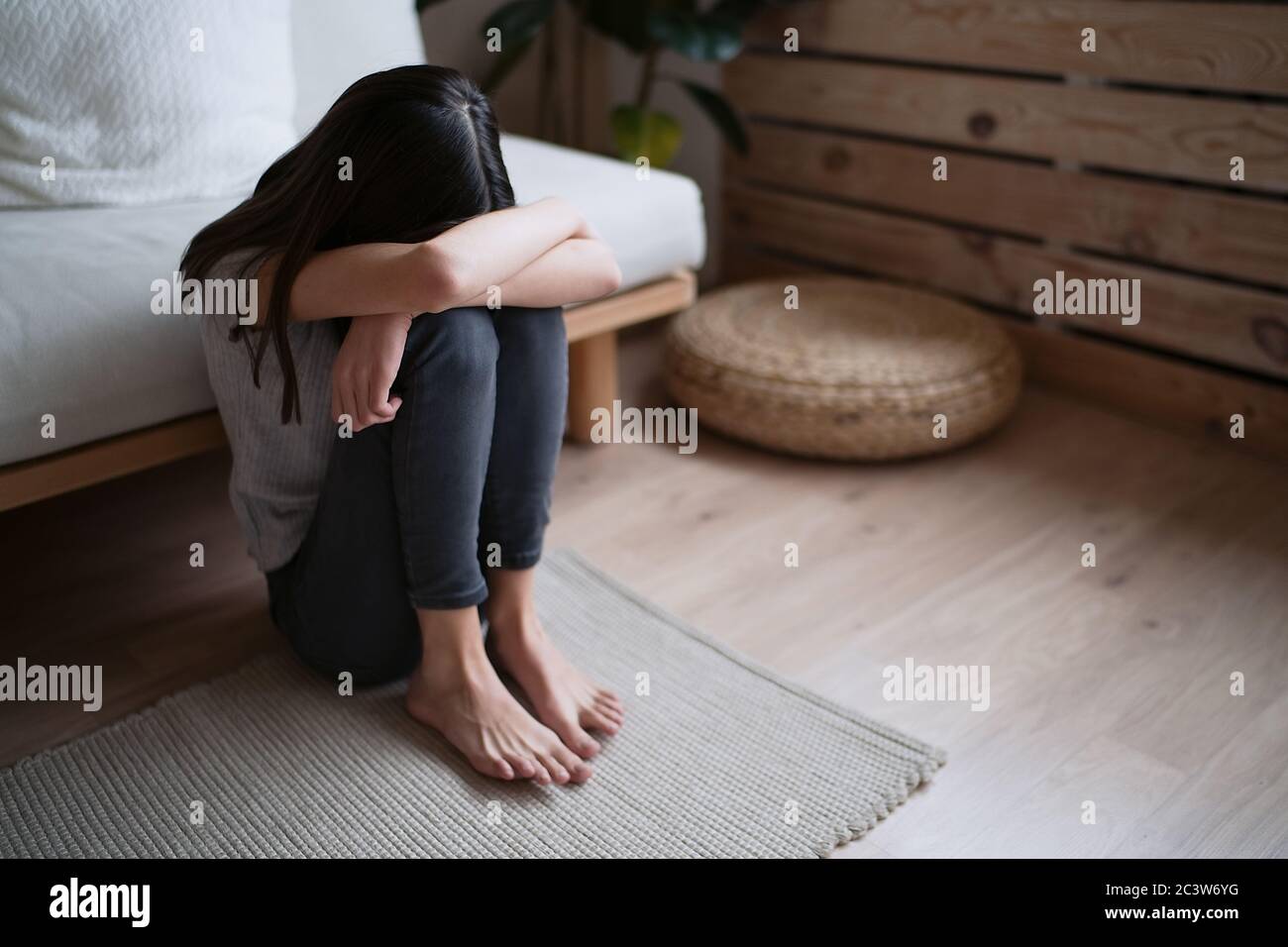 Sad teenager feeling bad alone holding head in hands, feeling depressed ...