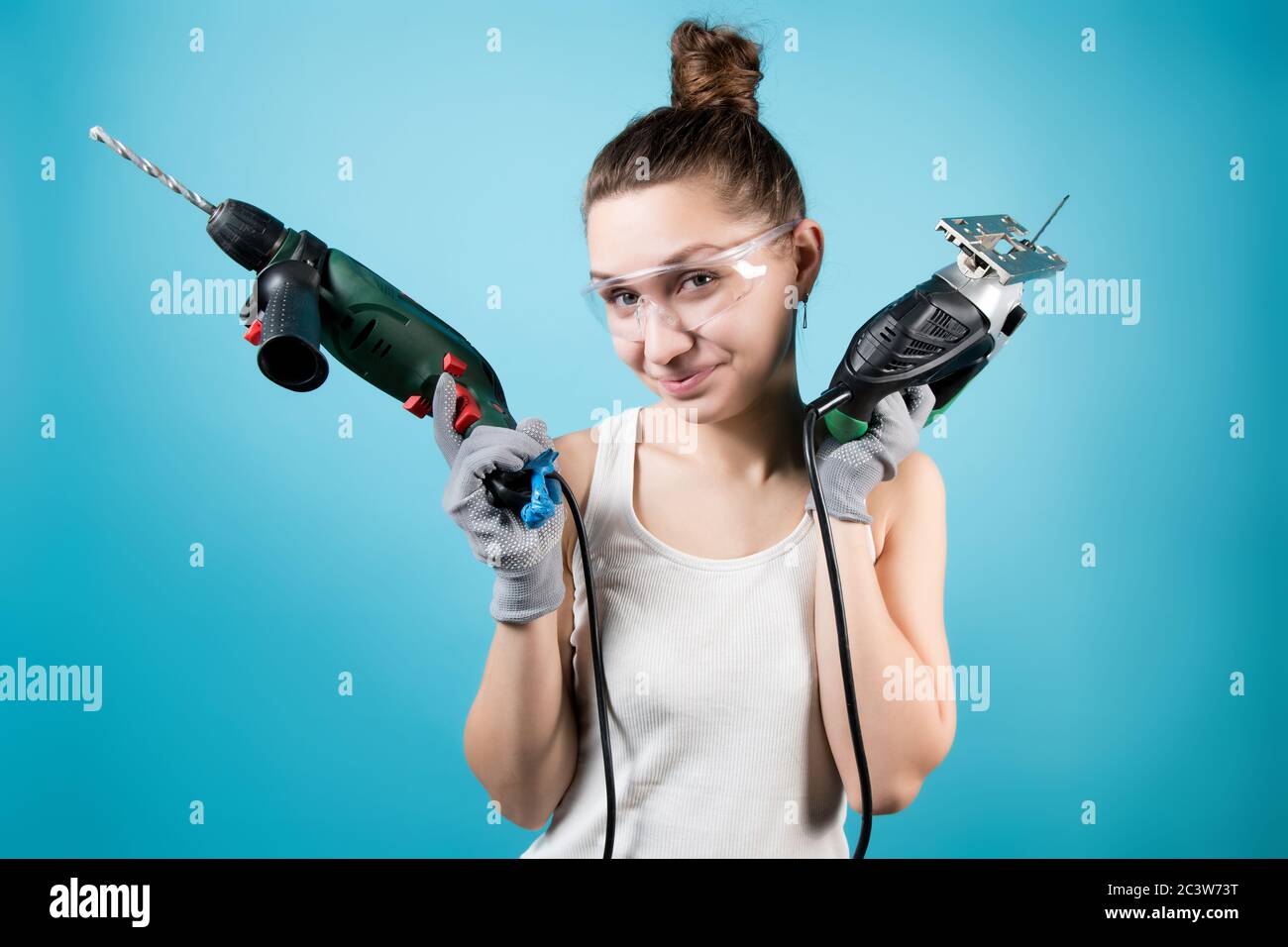 Woman man tools drill hi-res stock photography and images - Alamy