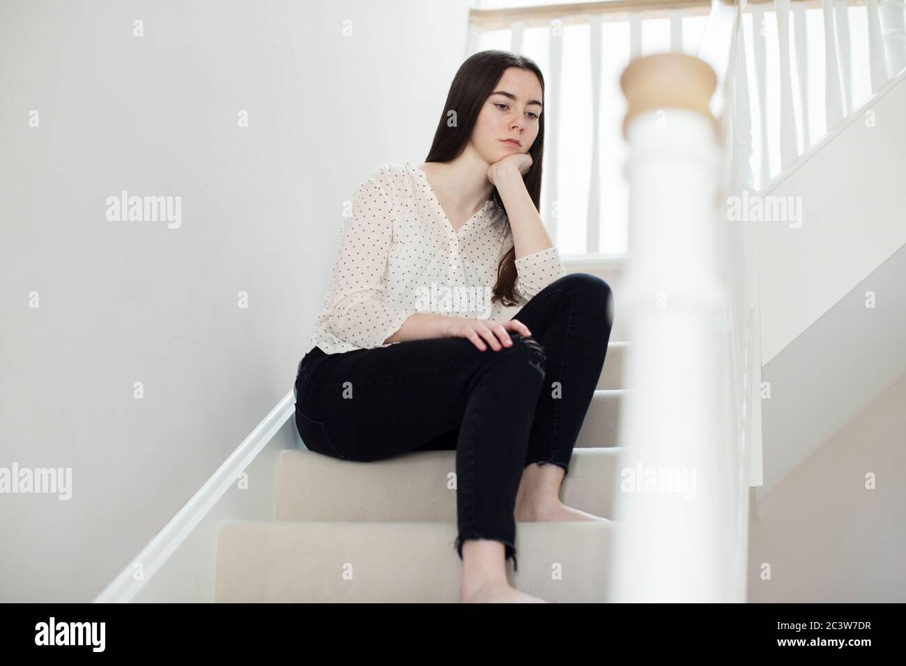 Teen girl sitting on stairs hi-res stock photography and images - Alamy