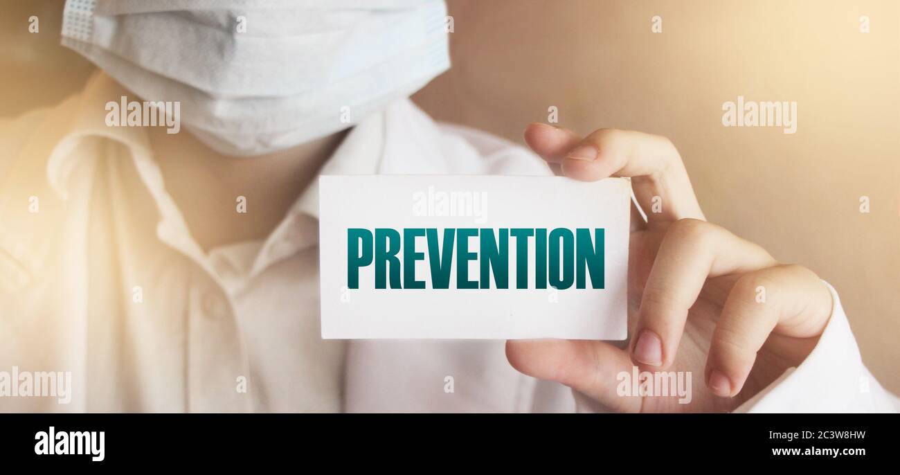 Doctor holding a card with text PREVENTION medical concept Stock Photo ...