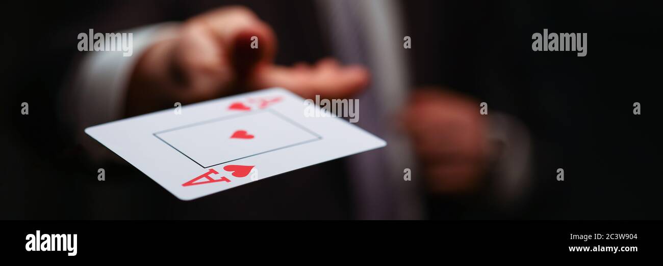 Hidden ace in black jacket Stock Photo - Alamy