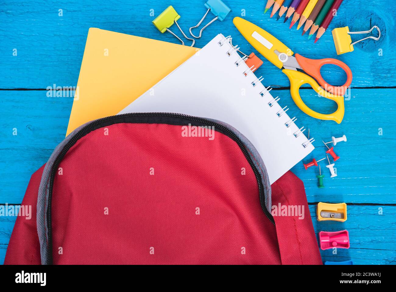 Top view flat lay of red school bag backpack and accessories tools for ...