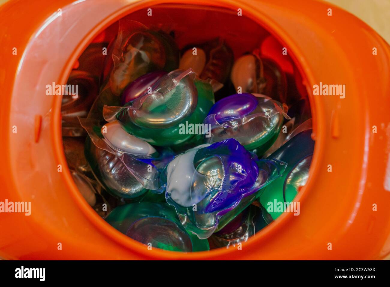 An open container of washing detergent capsules for laundry use Stock ...
