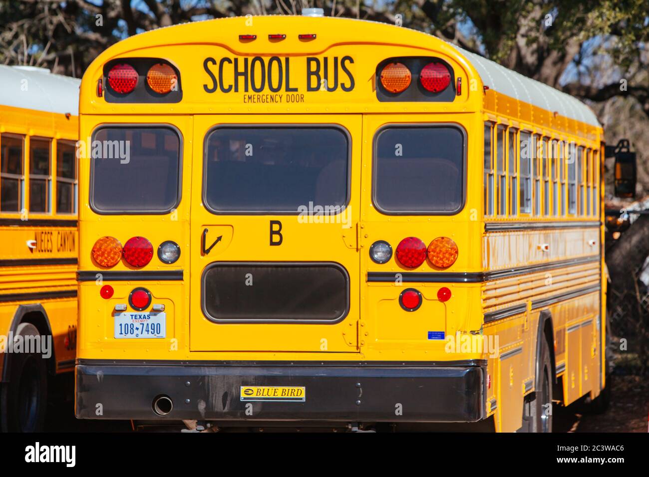 Yellow american school bus park hi-res stock photography and images - Alamy