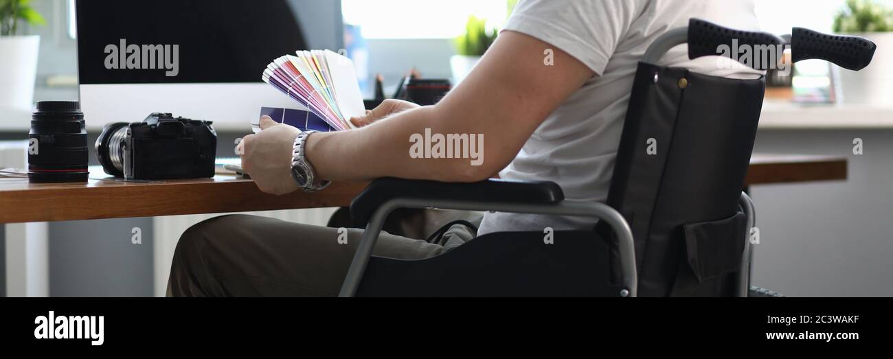 Talented man in adapted workplace Stock Photo - Alamy