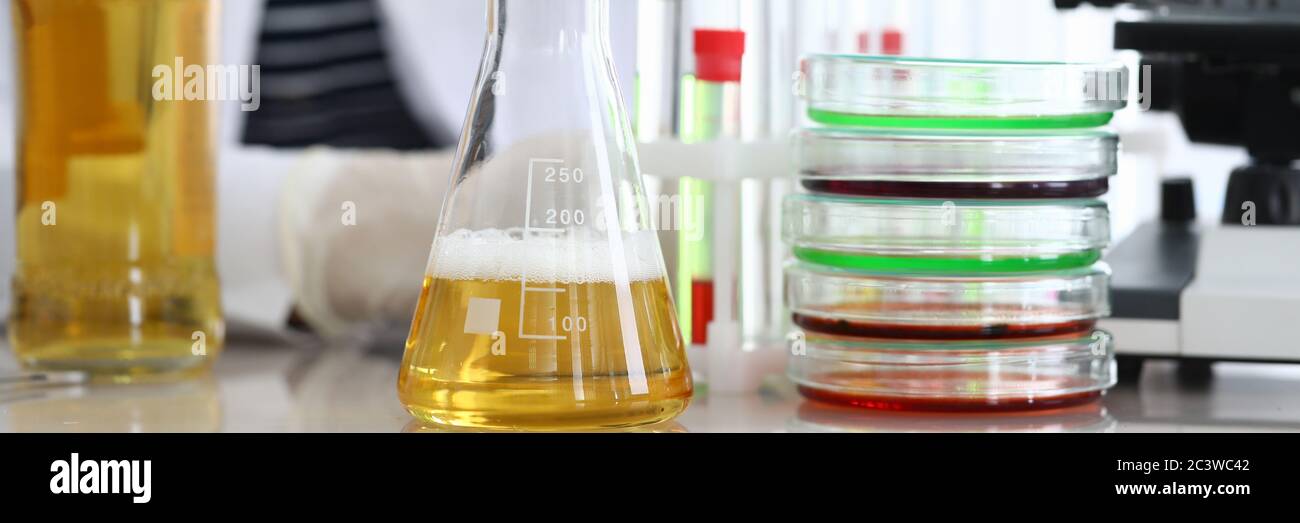 Researcher mixing test tube in lab Stock Photo - Alamy