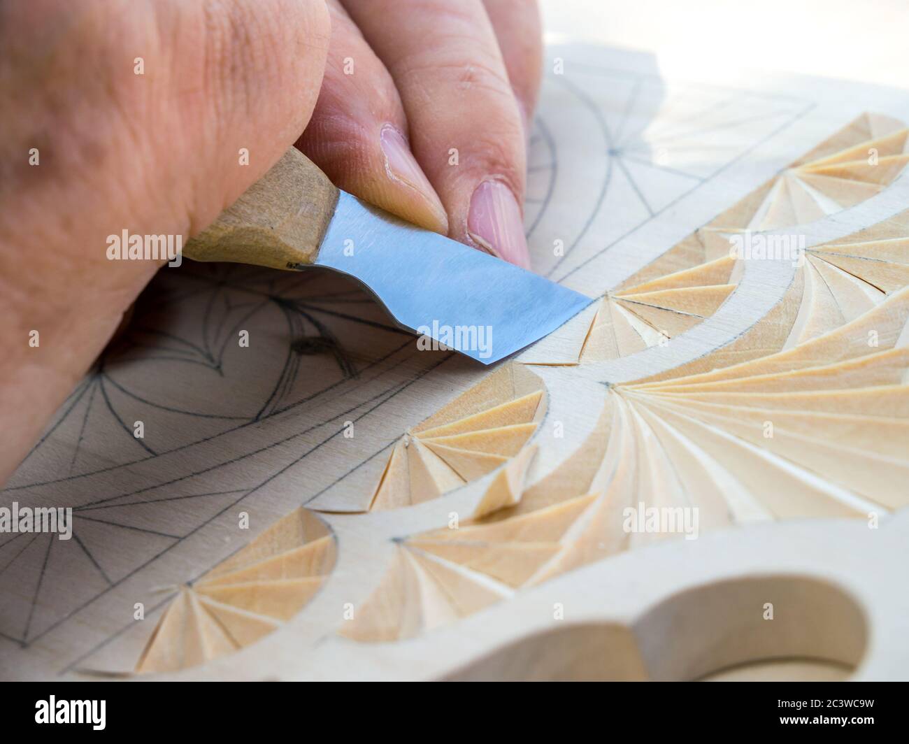 Man carving on wood with carving knife hi-res stock photography and ...