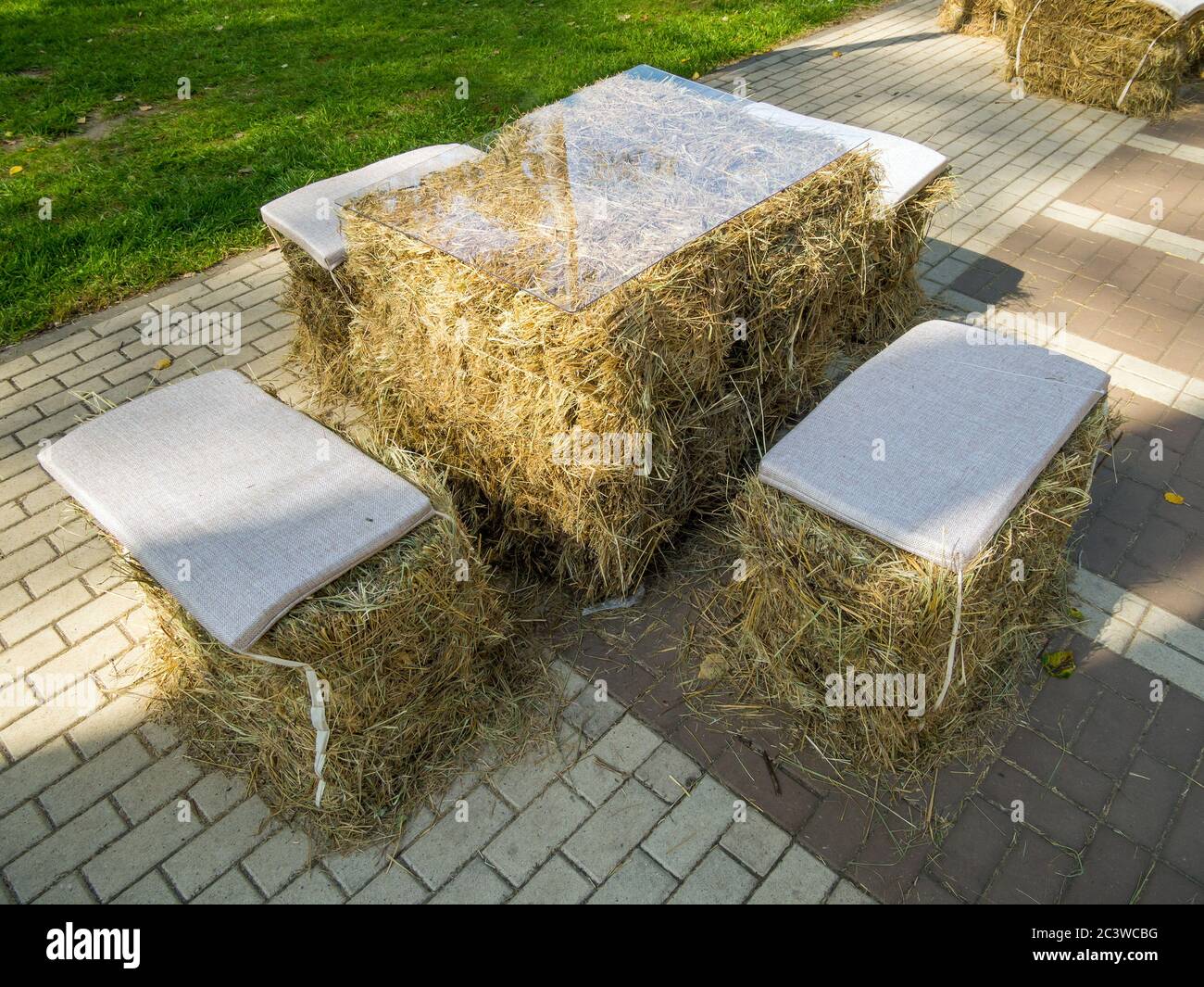 Street cafe table made of straw bales Stock Photo - Alamy