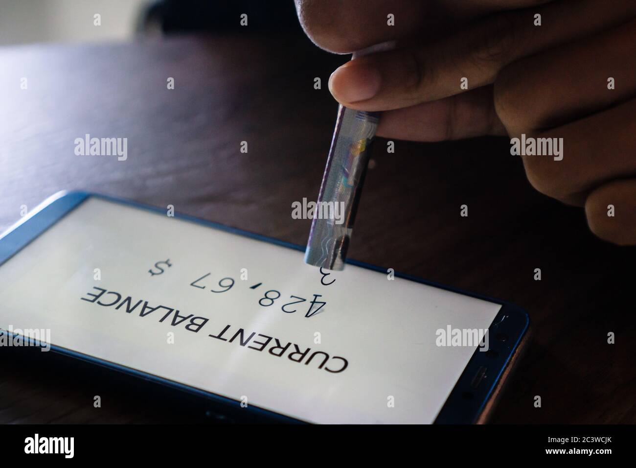 Drug addict snorting the balance of his bank account on the phone Stock ...