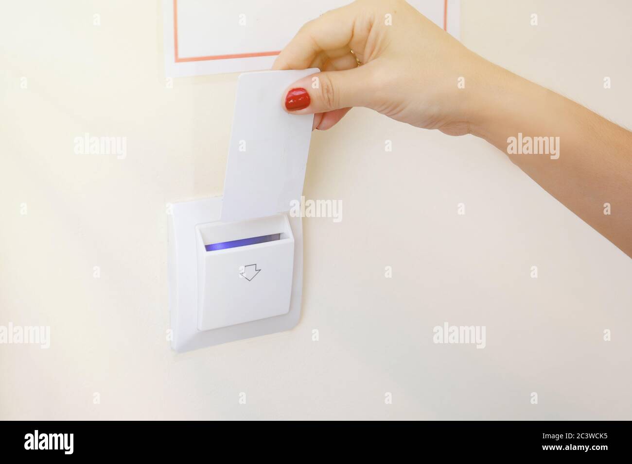 Women's hand delivers card to enter with scanner Stock Photo - Alamy