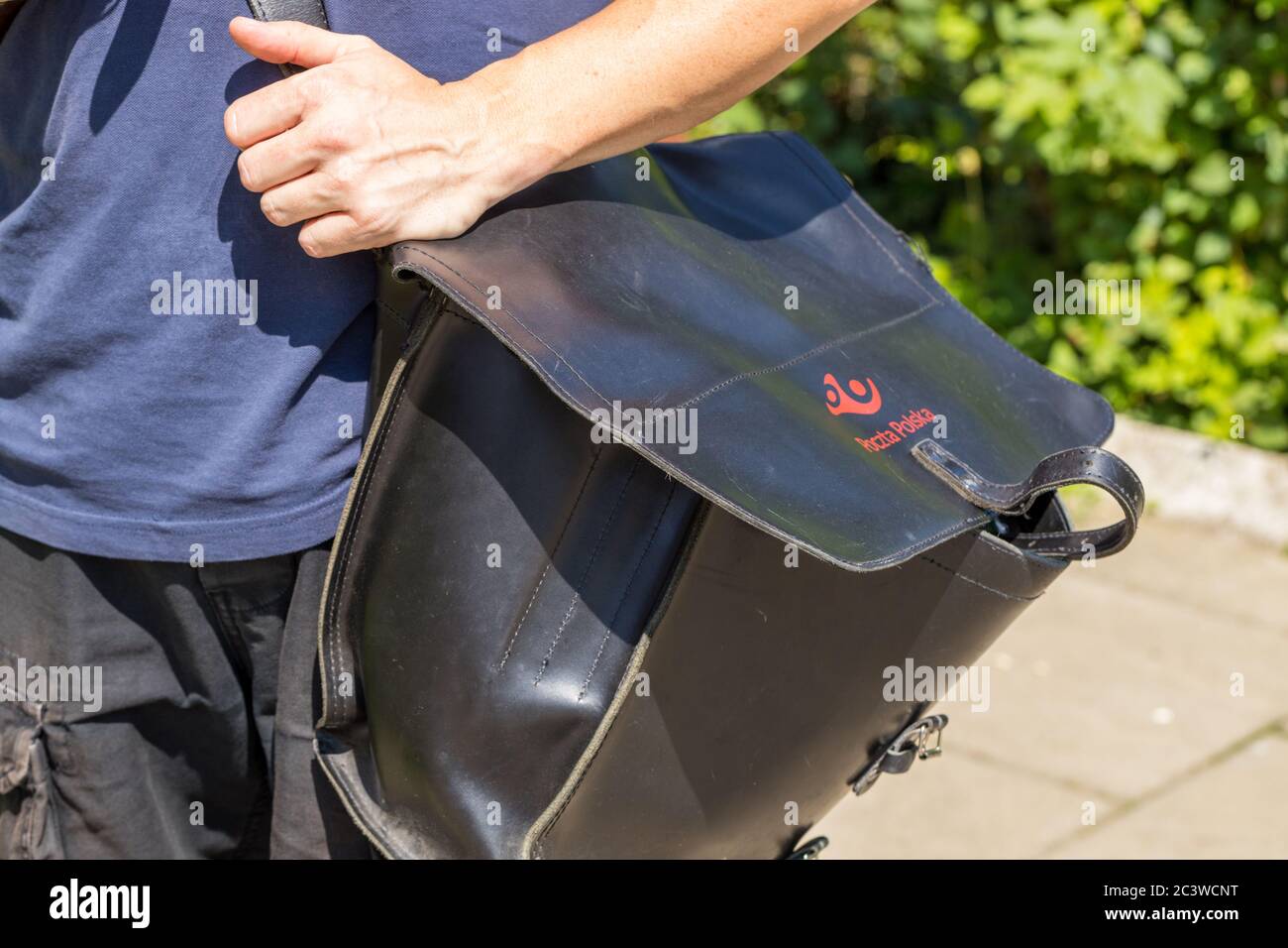 Postman delivering parcels, Bag of a Polish postal worker, Full of ...