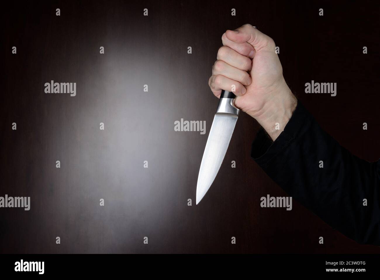 Hand with knife hi-res stock photography and images - Alamy