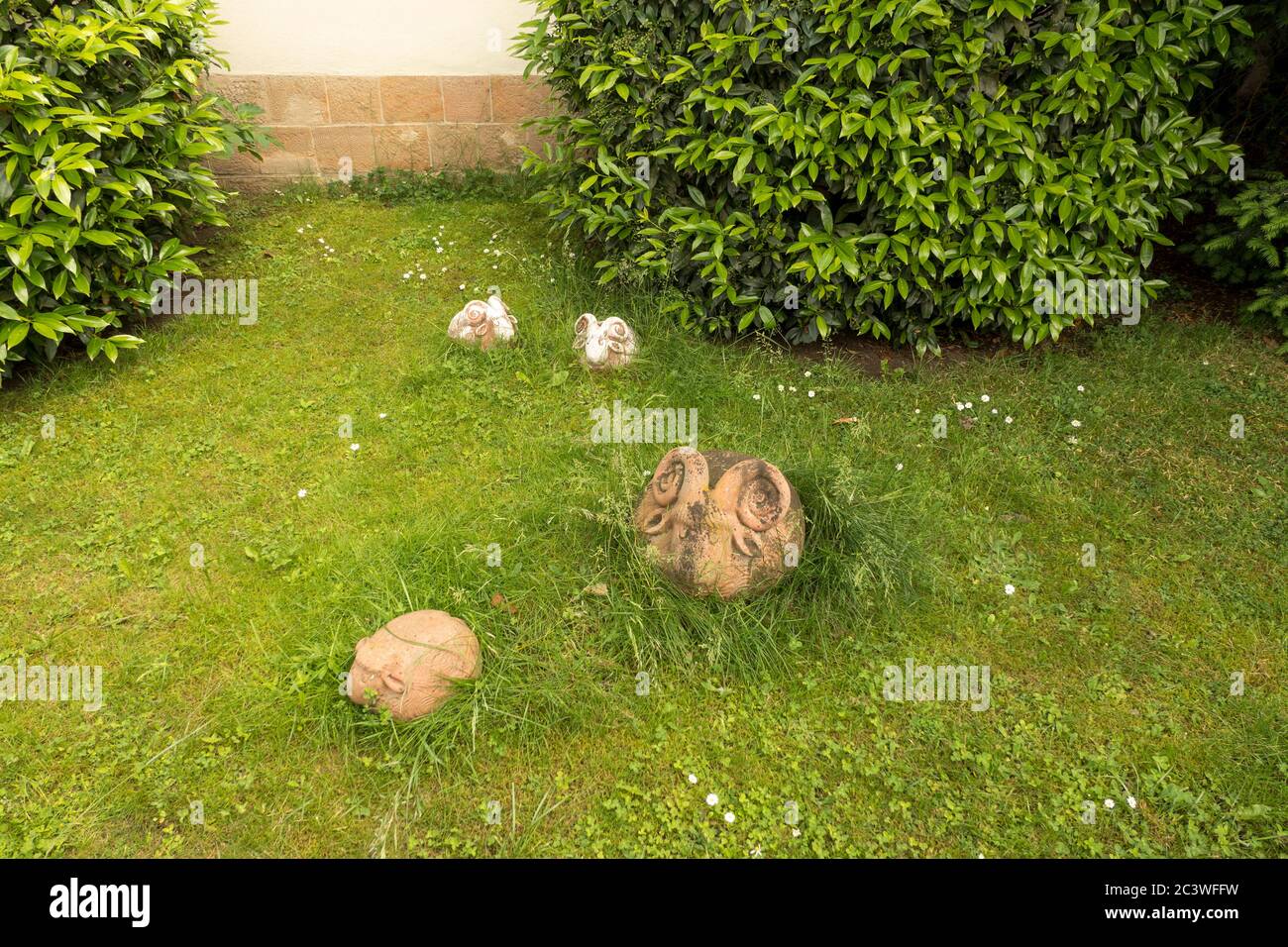 Stone ram decoration in the garden Stock Photo - Alamy