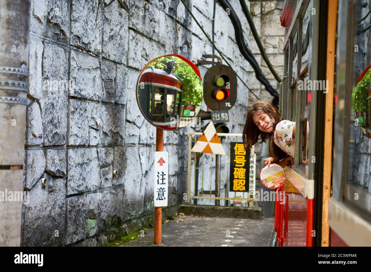 Girl having fun on the train in Hakone, Japan Stock Photo - Alamy