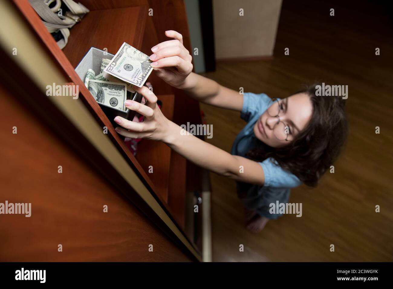 Putting box on shelf hi-res stock photography and images - Alamy