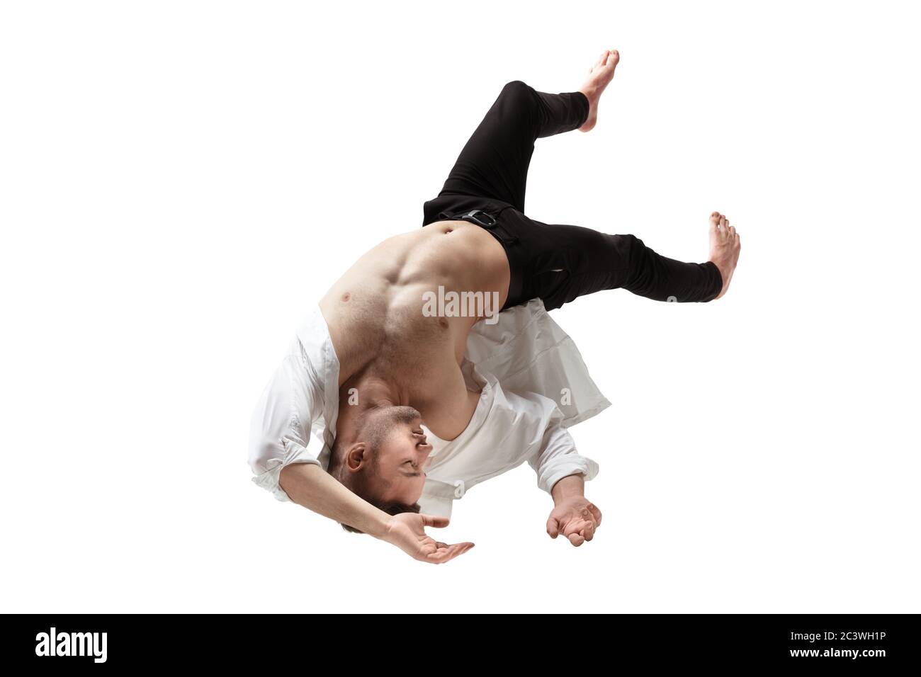 Mid-air beauty cought in moment. Full length shot of young man hovering ...