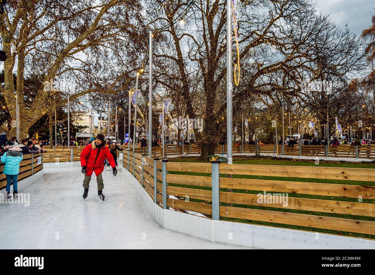 Christmas ice skating in the center of Vienna. Ice rink at Rathauspark ...