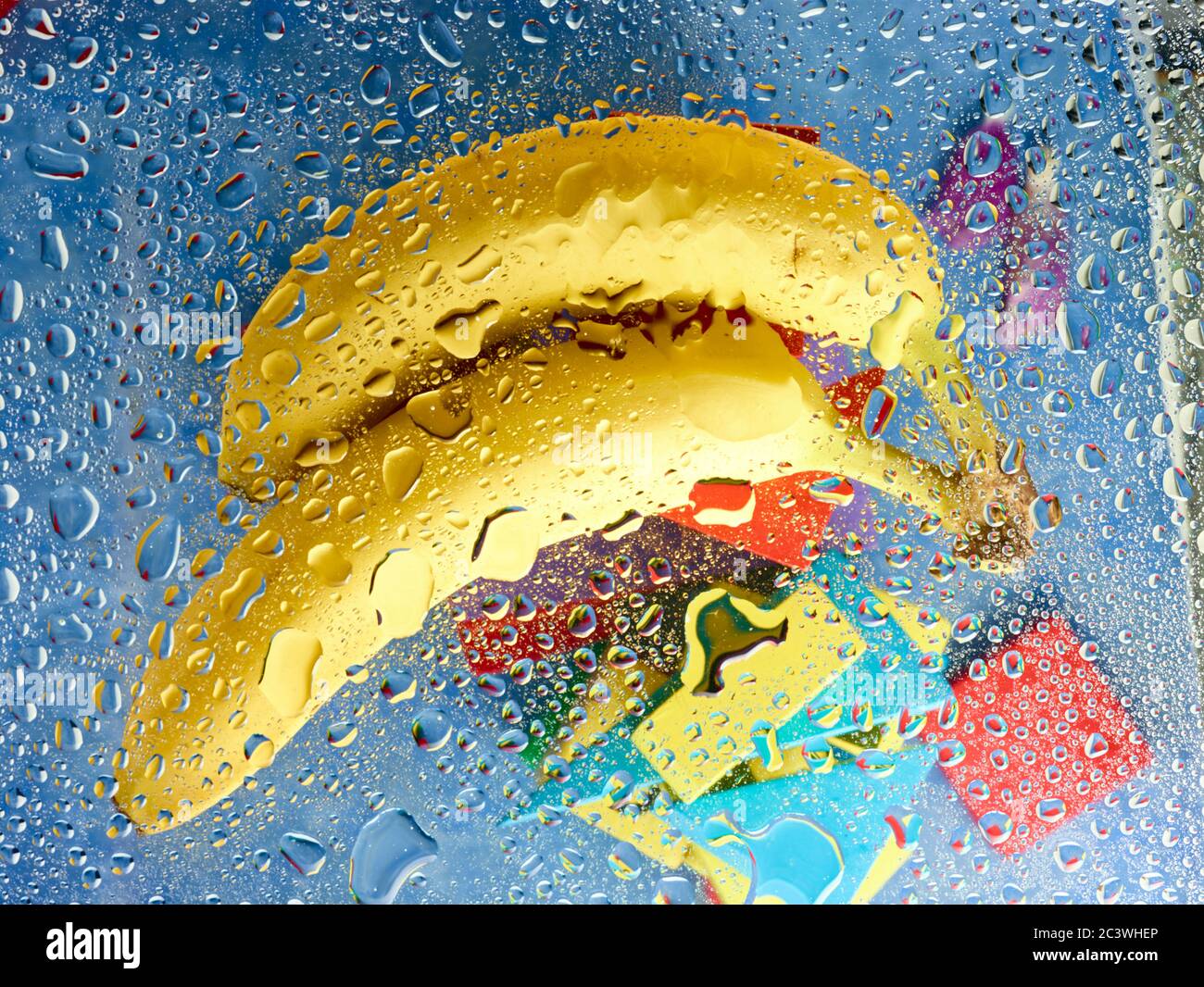 Ripe bananas and water droplets close-up semi-abstract natural ...