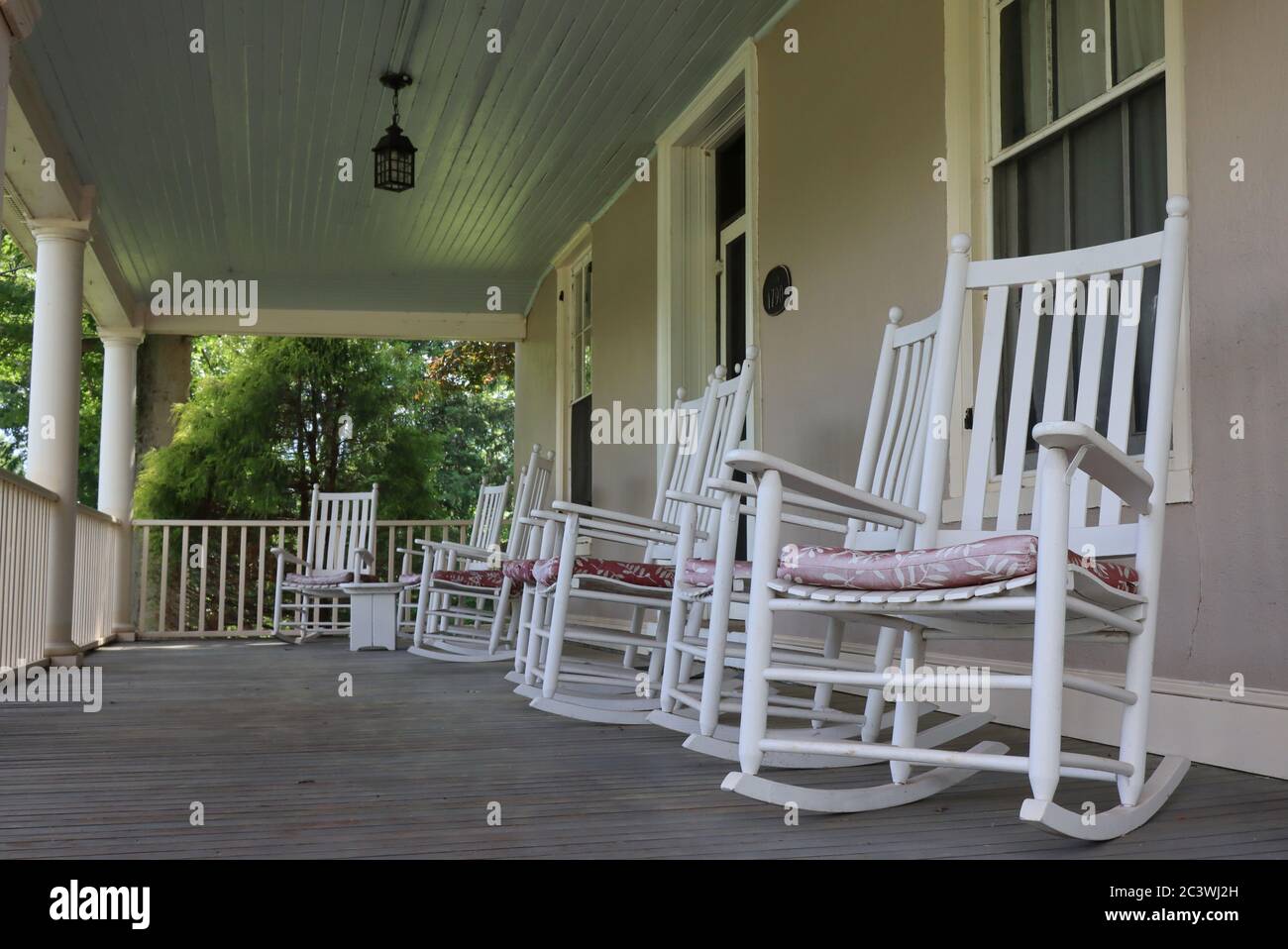 Wooden rocking chairs hi-res stock photography and images - Alamy