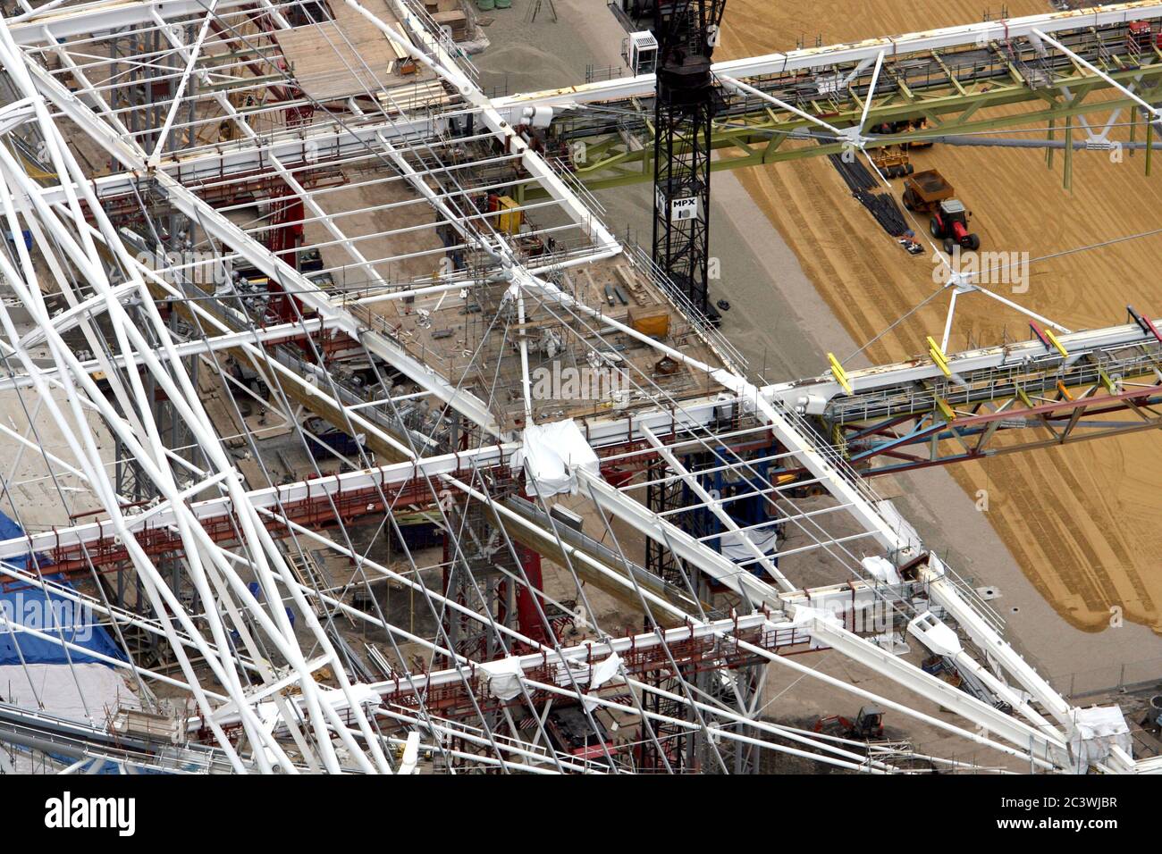 Rebuilding Wembley Stadium. A girder falls from the roof structure and ...