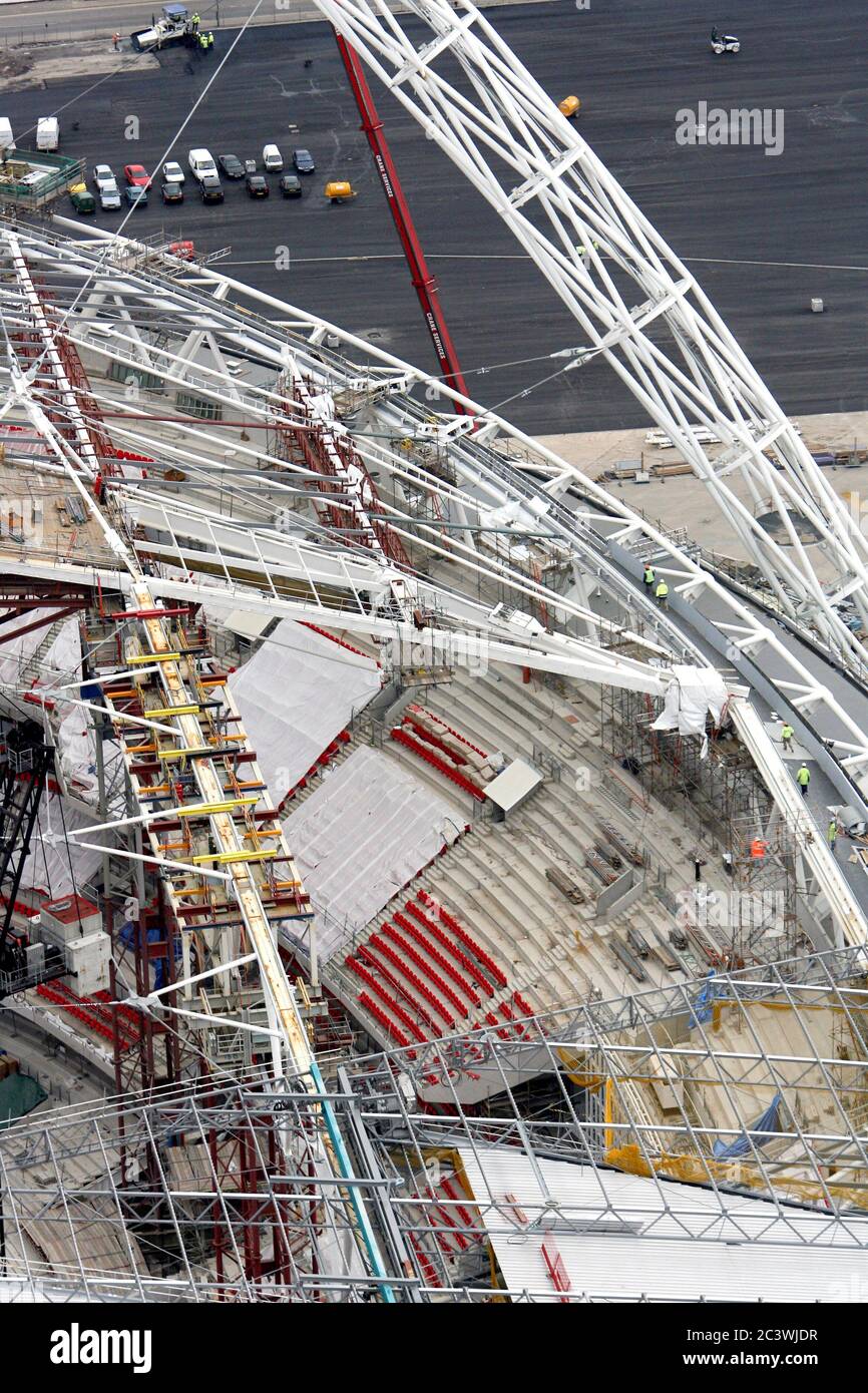 Rebuilding Wembley Stadium. A girder falls from the roof structure and ...