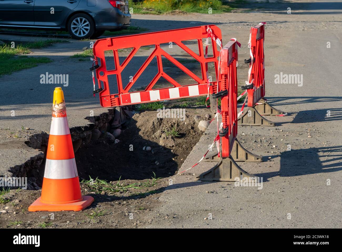 Traffic barriers surrounding street construction site Stock Photo - Alamy