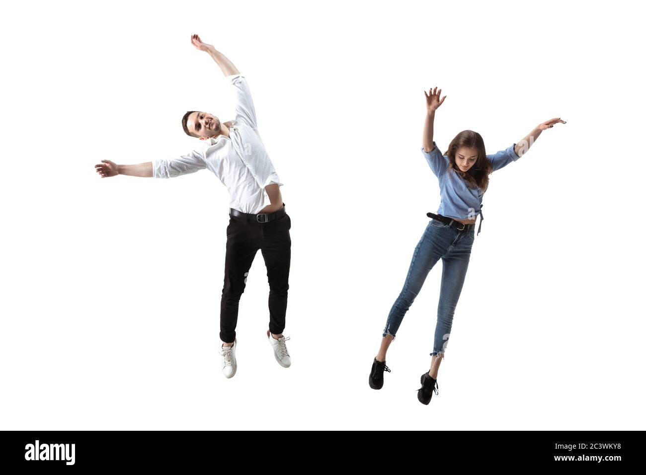 Mid-air beauty cought in moment. Full length shot of attractive young ...