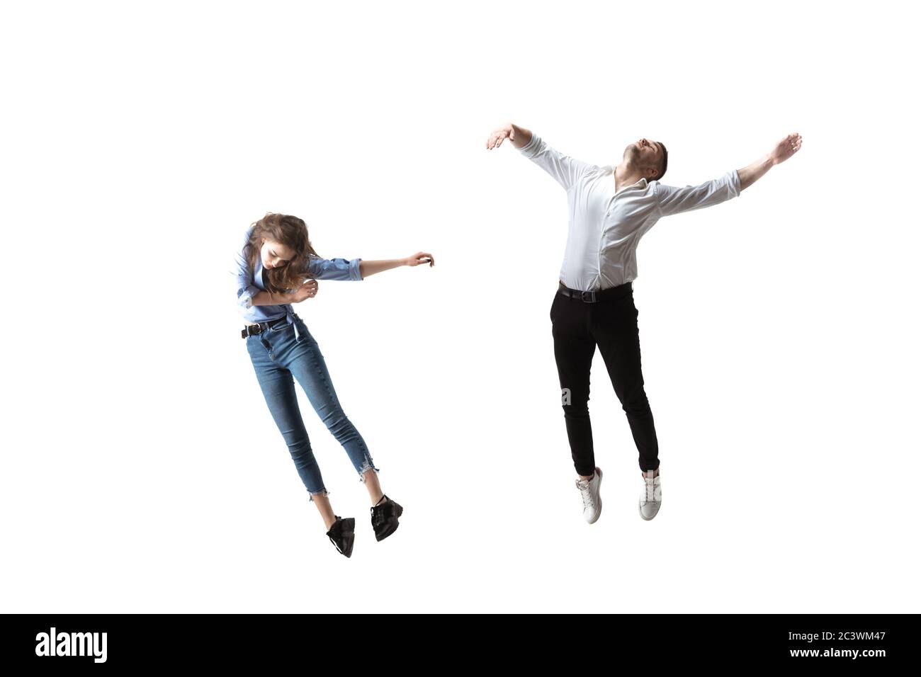 Mid-air beauty cought in moment. Full length shot of attractive young ...