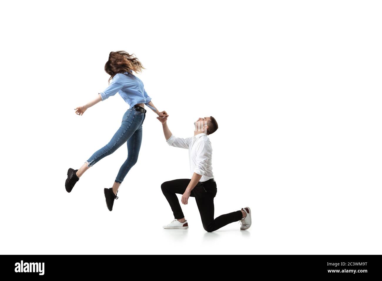 Mid-air beauty cought in moment. Full length shot of attractive young ...