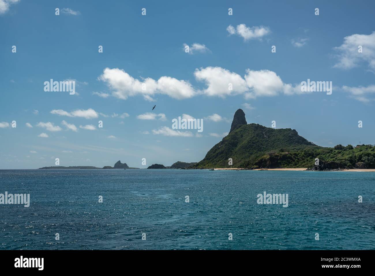 Beautiful view of Morro do Pico background from the sea at Fernando de ...