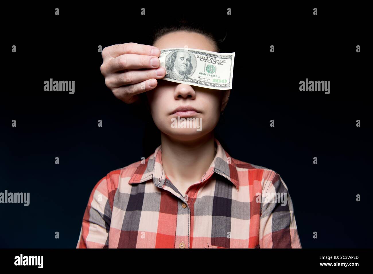 Hands close woman eyes with one hundred dollar bill. Buying silence for ...