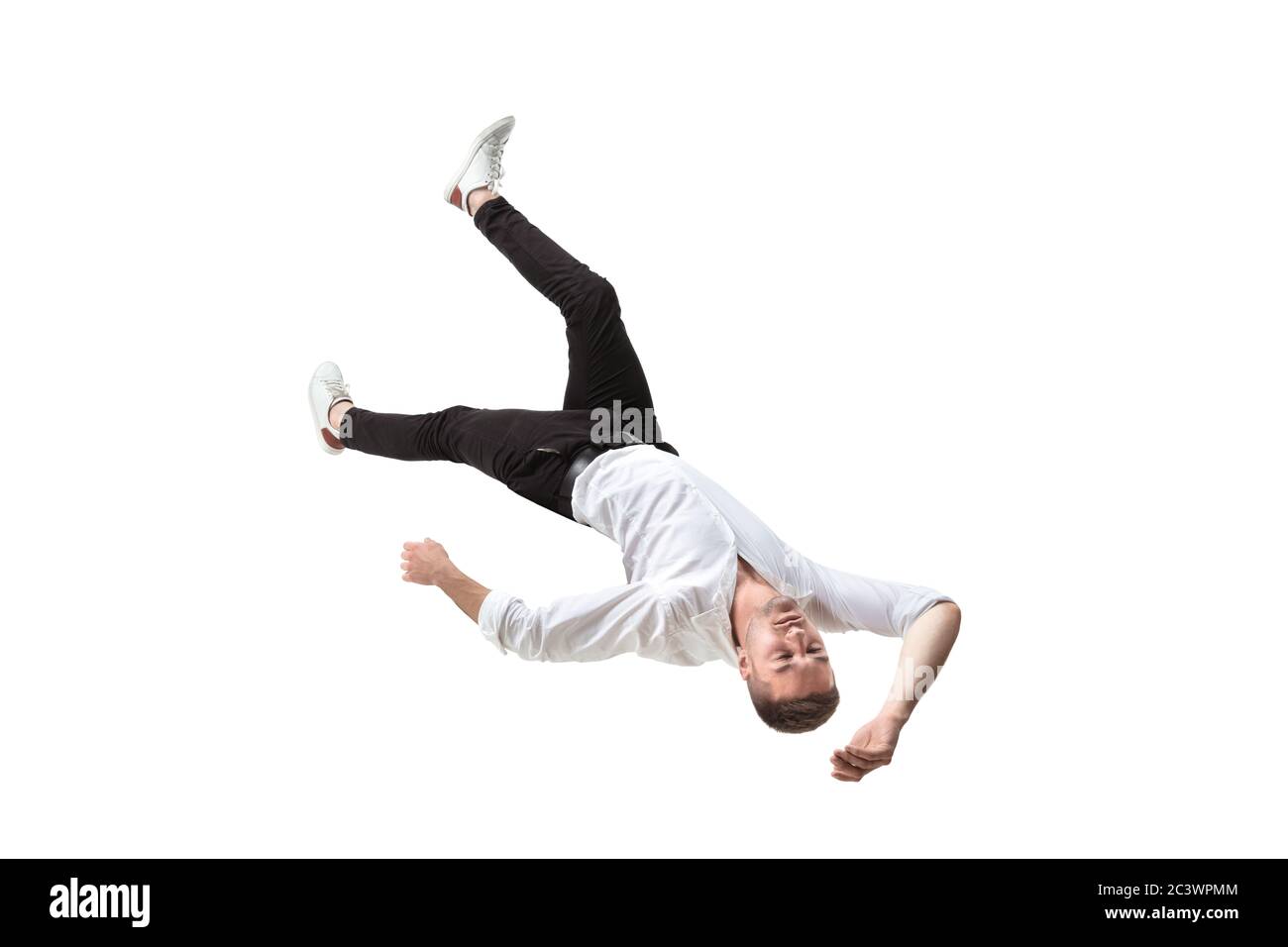 Mid-air beauty cought in moment. Full length shot of young man hovering ...