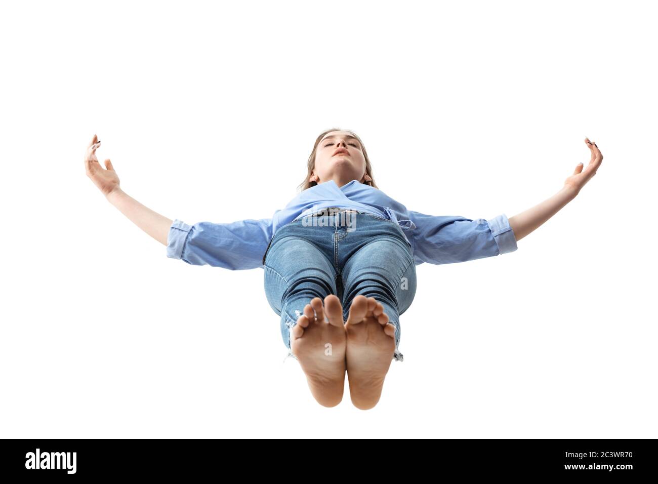 Mid-air beauty cought in moment. Full length shot of attractive young ...