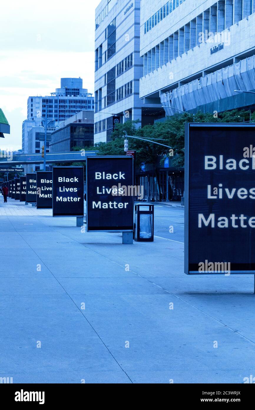 Multiple electronic signs in perspective angle next toLincoln Center in ...