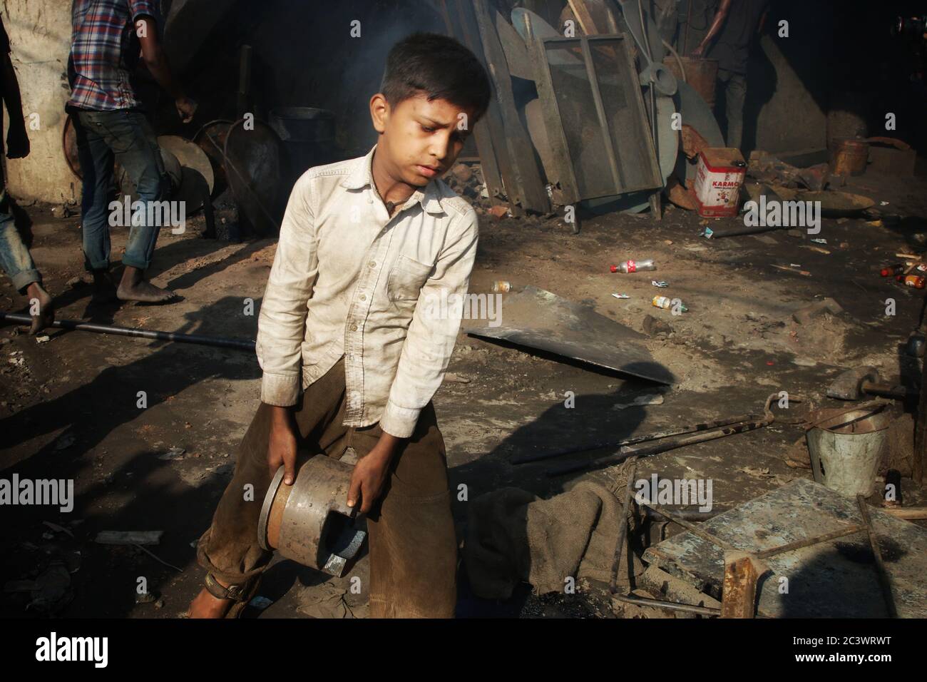 A young boy works as a child labourer at a dockyard in Keraniganj near ...