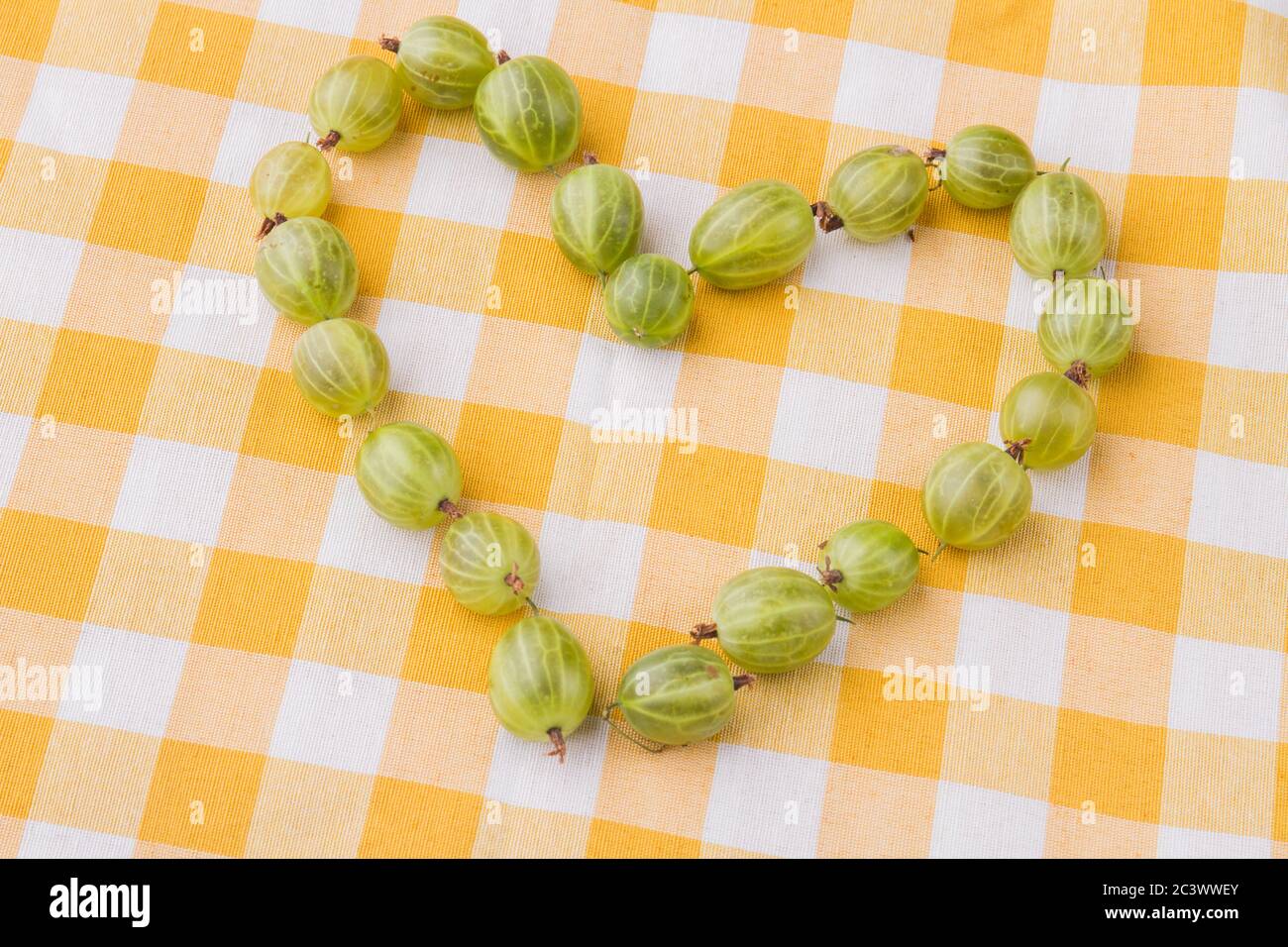 Сherry-cherry-plums heart form Stock Photo - Alamy