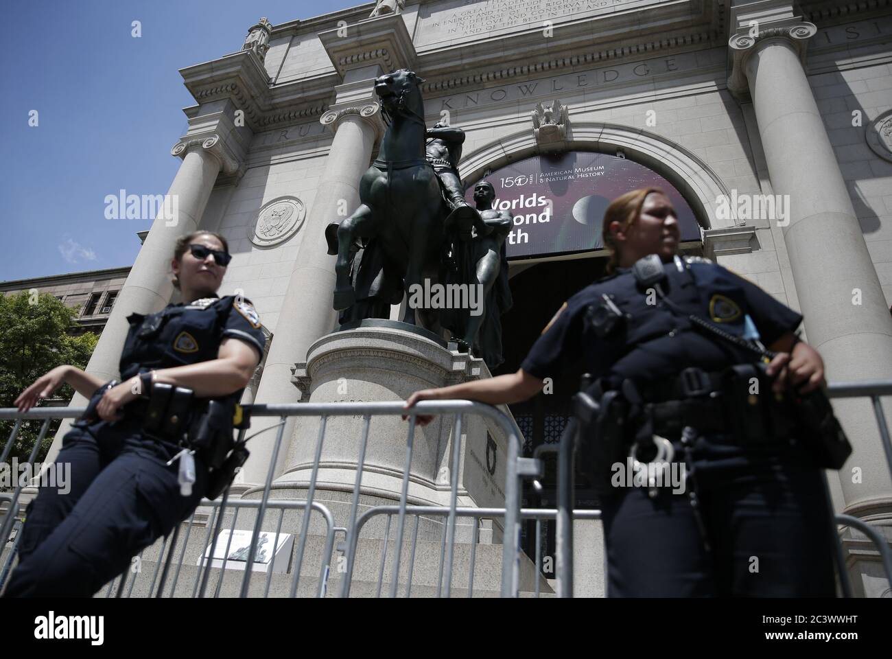 Police barricades surround the area around a bronze statue of former ...