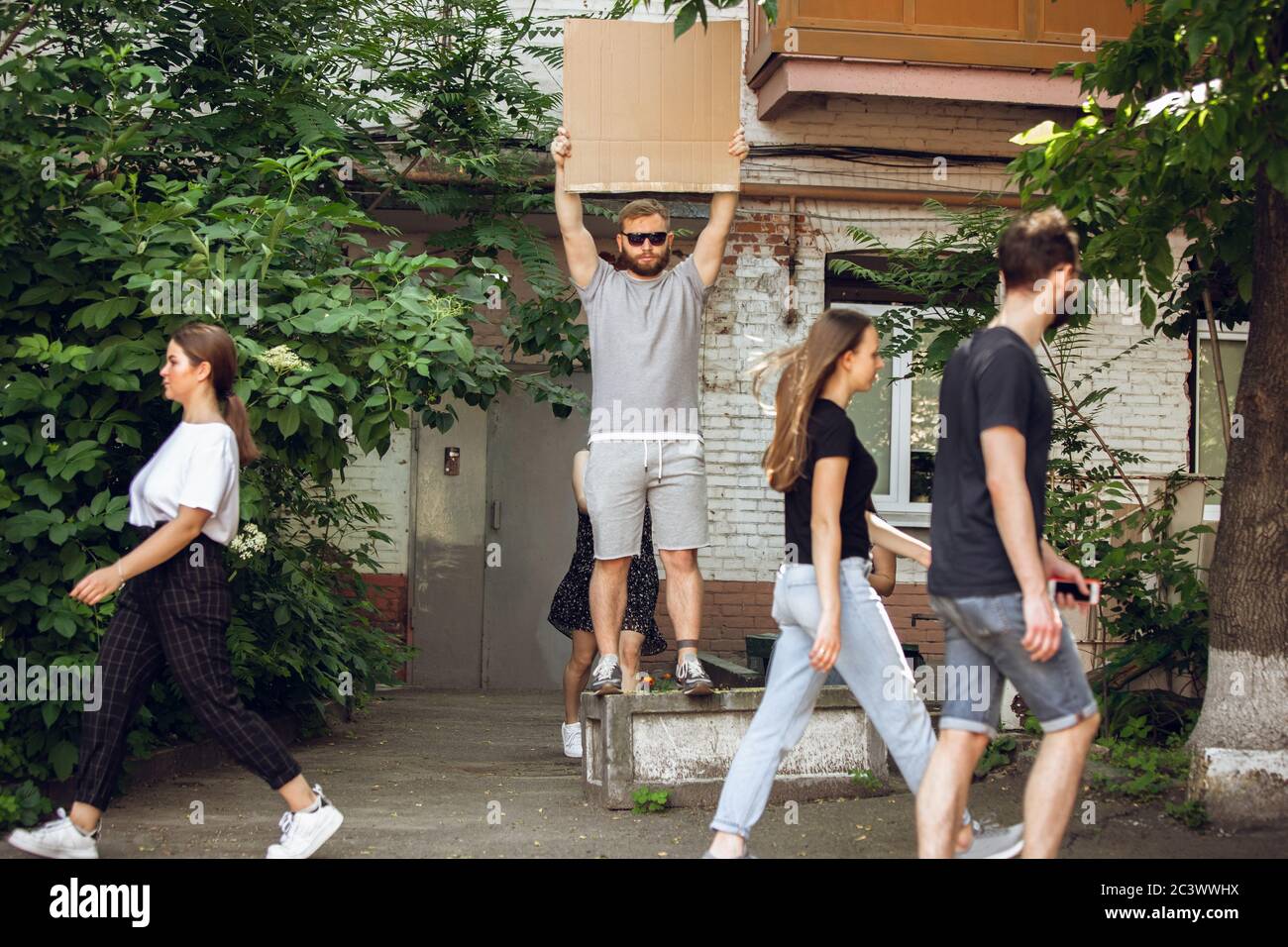 Dude with sign - man stands protesting things that annoy him. Solo ...