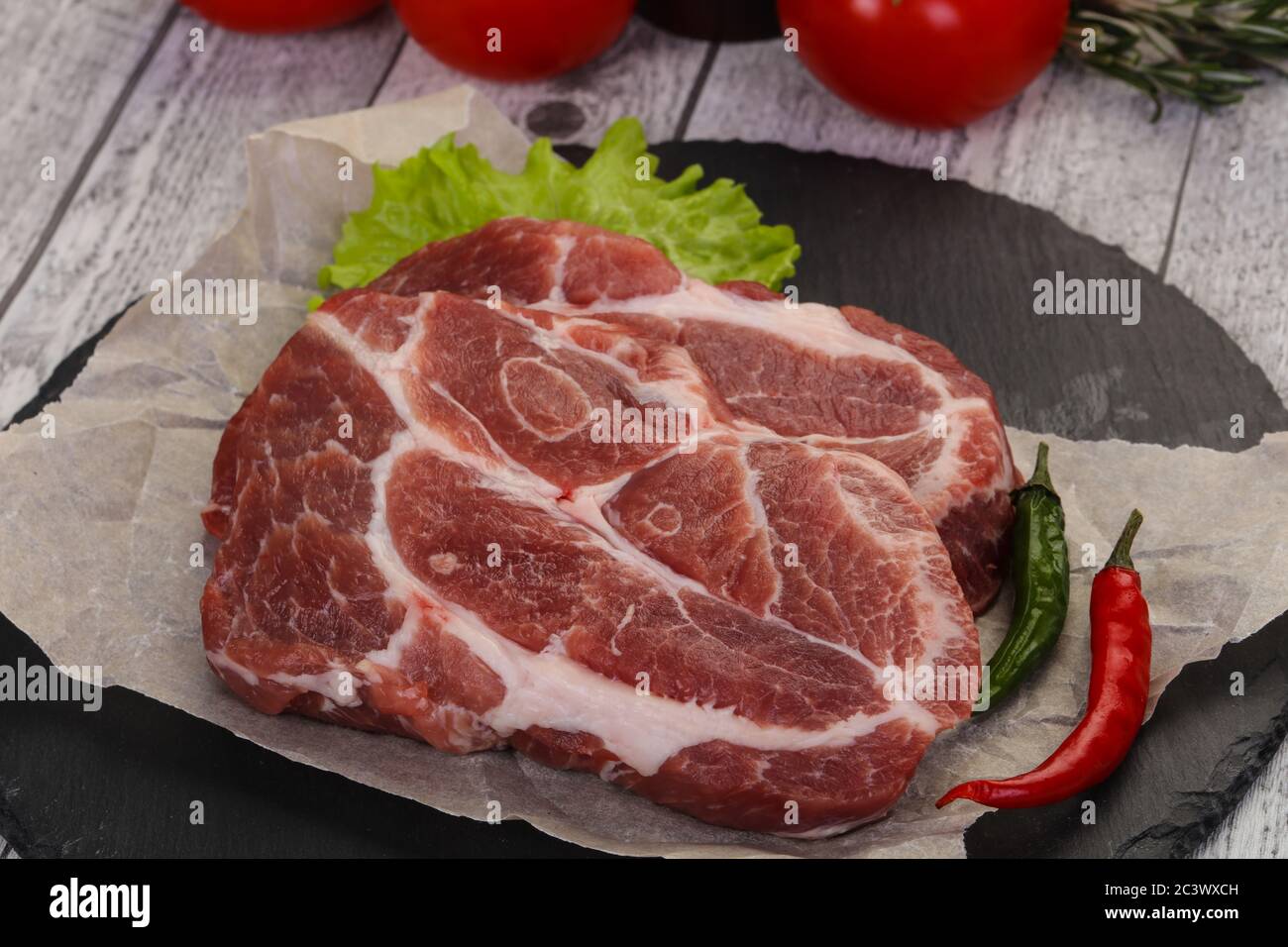 Raw pork neck steak ready for cooking Stock Photo - Alamy