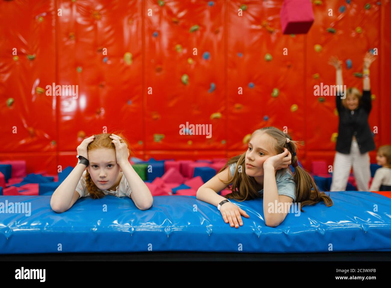 Tired children and mother plays with soft cubes Stock Photo - Alamy