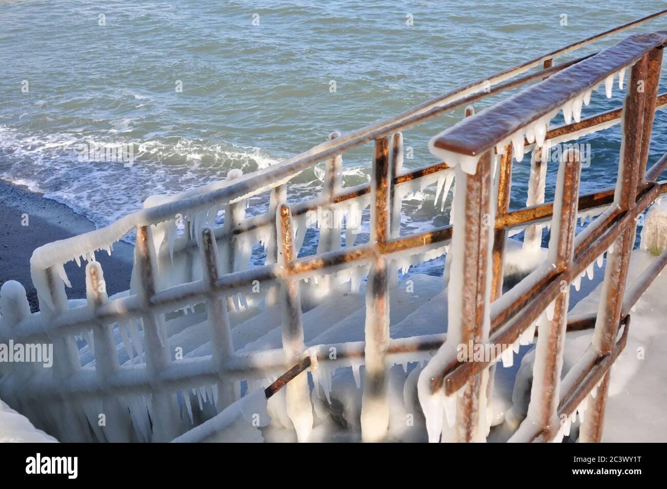 Icy staircase. Descent to the sea. Frozen steps Stock Photo - Alamy