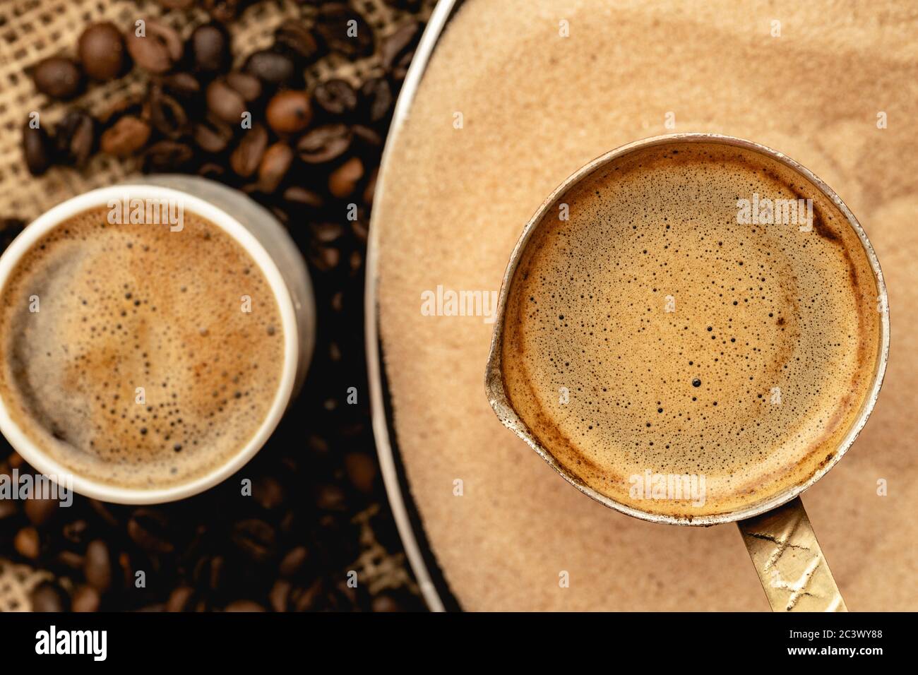 Turkish coffee prepared in sand with turk Stock Photo - Alamy