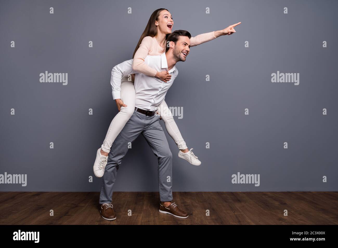 Full body profile photo pretty lady handsome guy couple carry piggyback ...