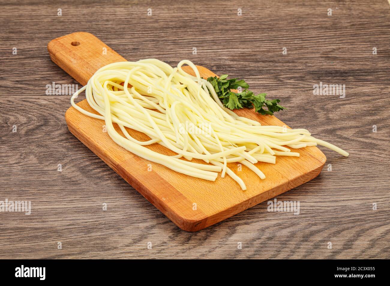 Chechil spaghetti cheese snack over board Stock Photo - Alamy