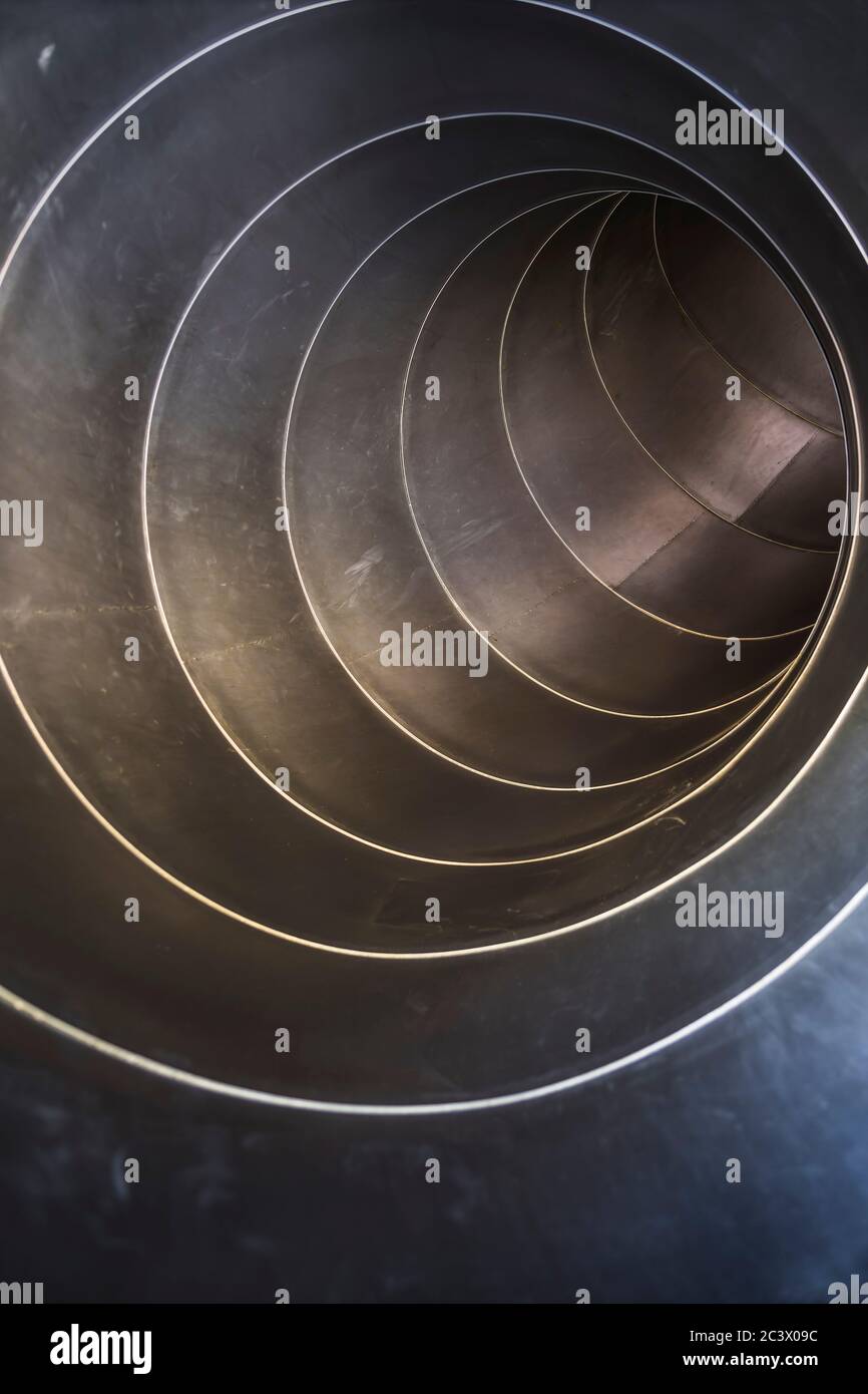 stainless steel sliding tube on a playground Stock Photo - Alamy
