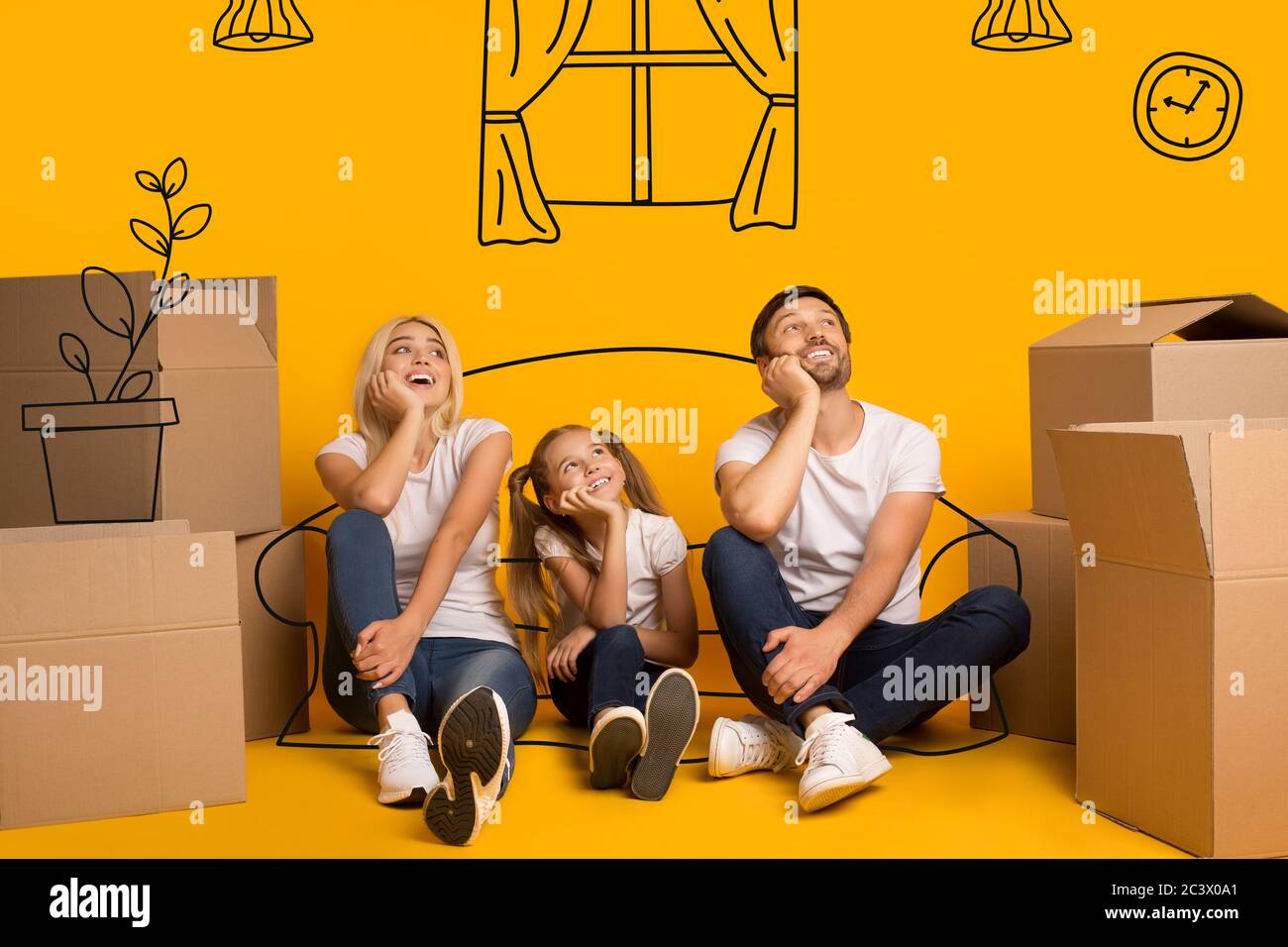 Happy parents and kid with carton boxes imagining their new home on ...